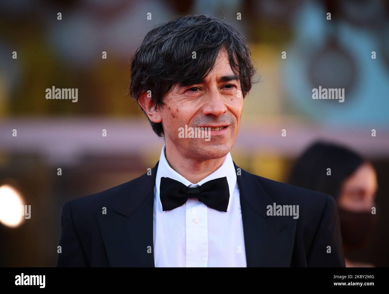 Luigi Lo Cascio poses on the red carpet during the 77th Venice Film ...