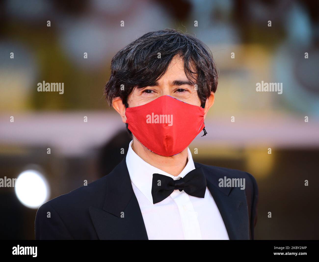 Luigi Lo Cascio poses on the red carpet during the 77th Venice Film ...