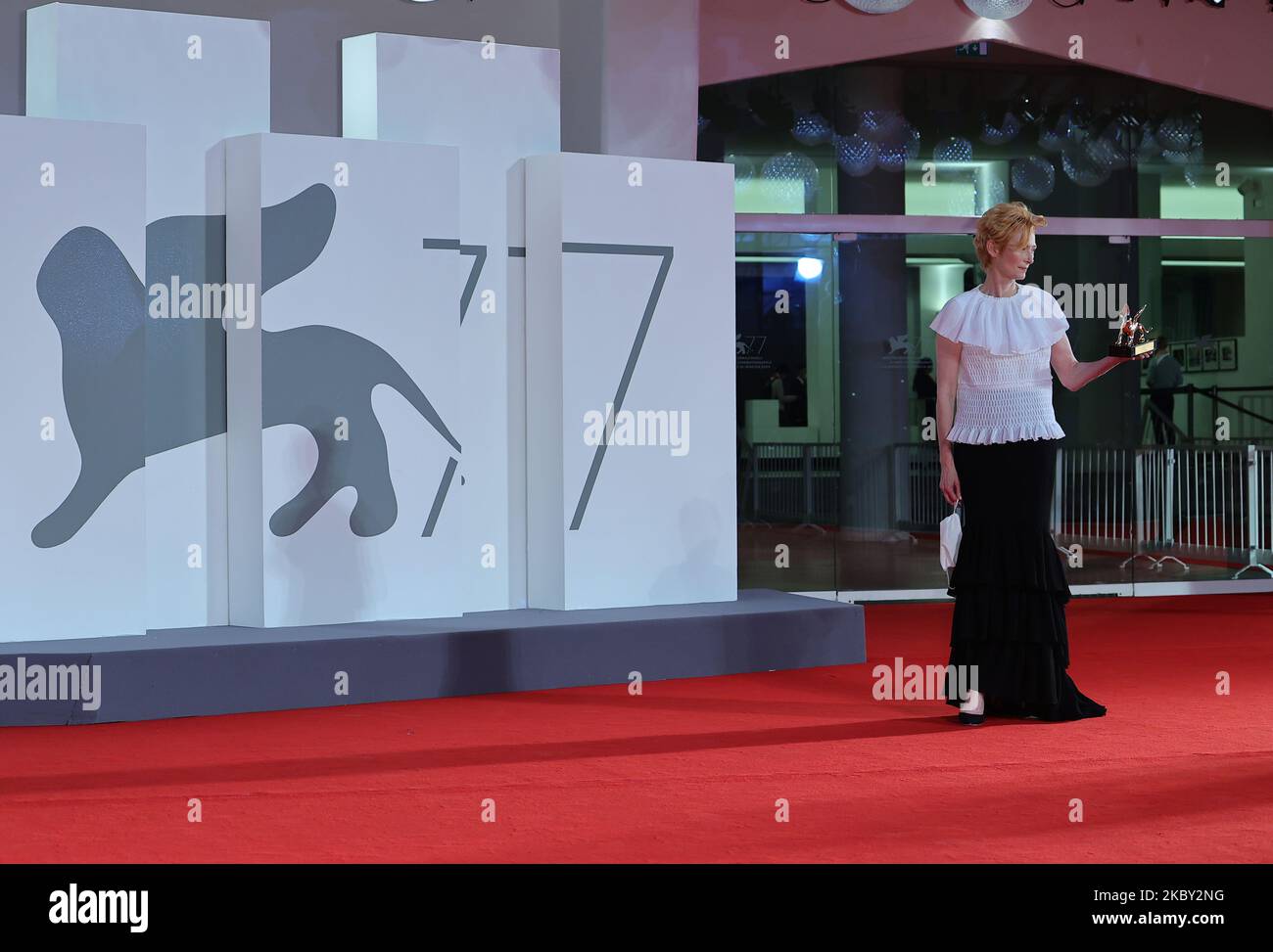 Tilda Swinton poses on the red carpet with the Golden Lion Lifetime ...