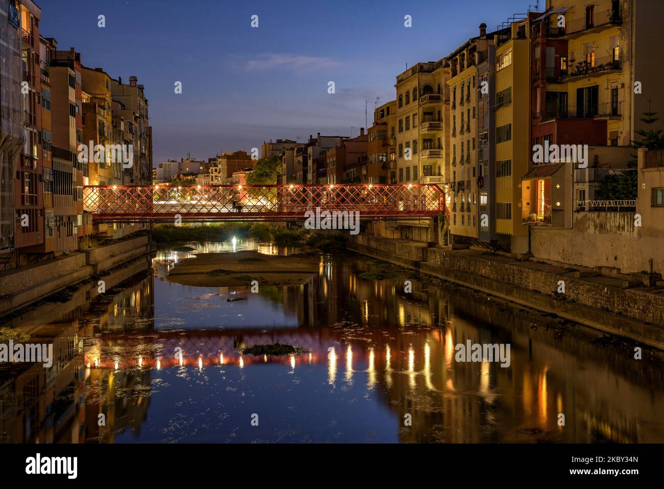 Houses next to the Onyar river as it passes through the city of Girona ...