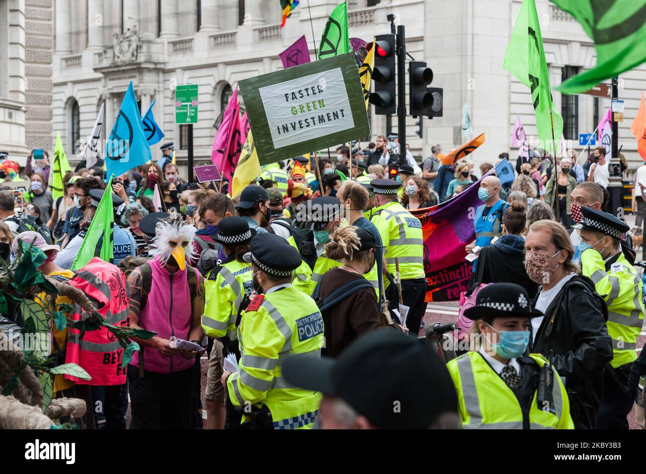 Extinction Rebellion activists take part in a "Carnival of Corruption ...