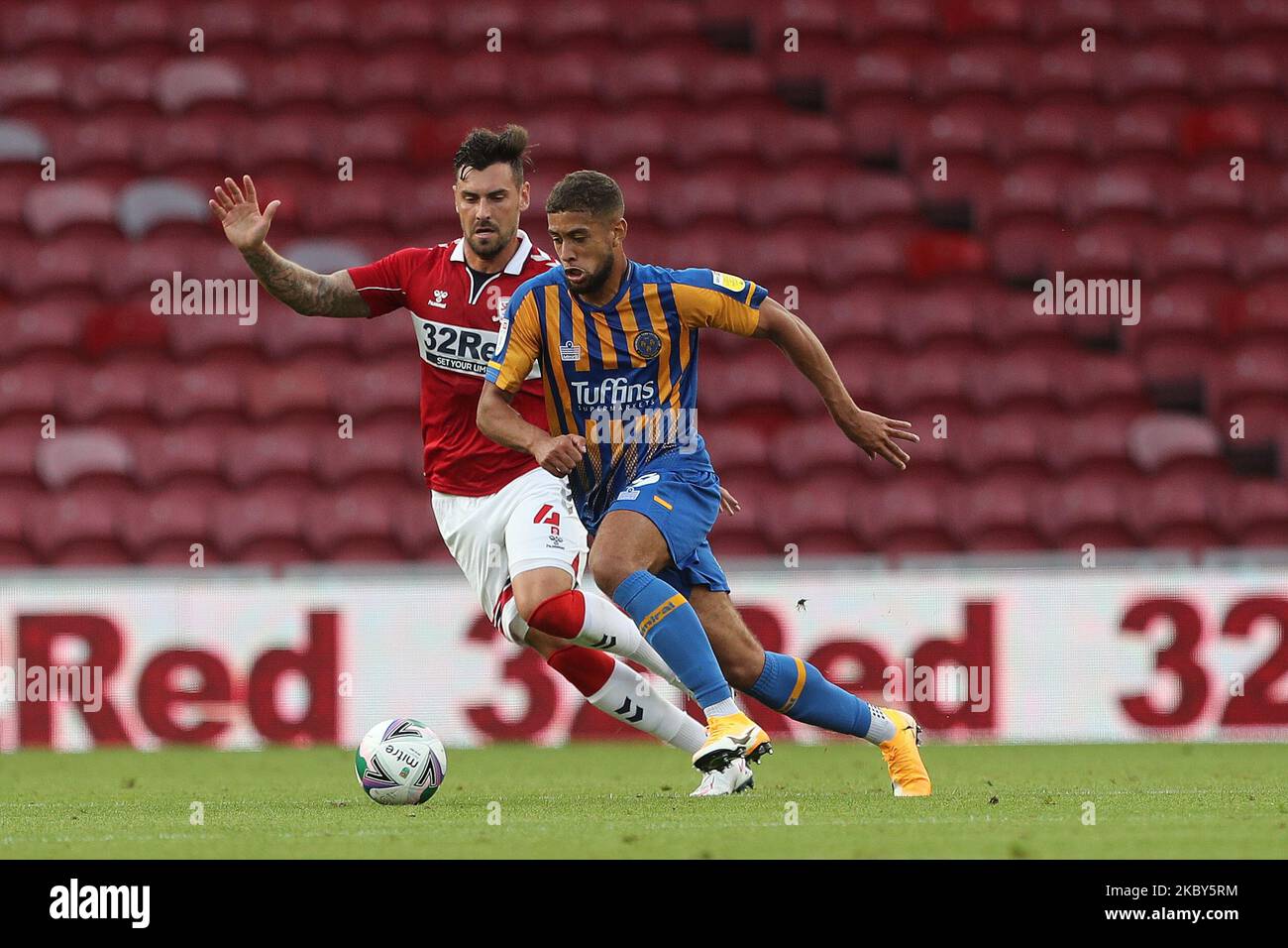 Shrewbury Town's Rekeil Pyke in action with Middlesbrough's Grant Hall ...