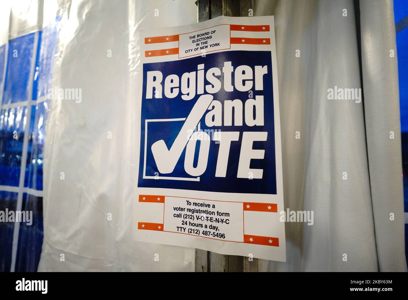 Posters that reads, “Register and Vote” are seen during a Steve Bannon ...