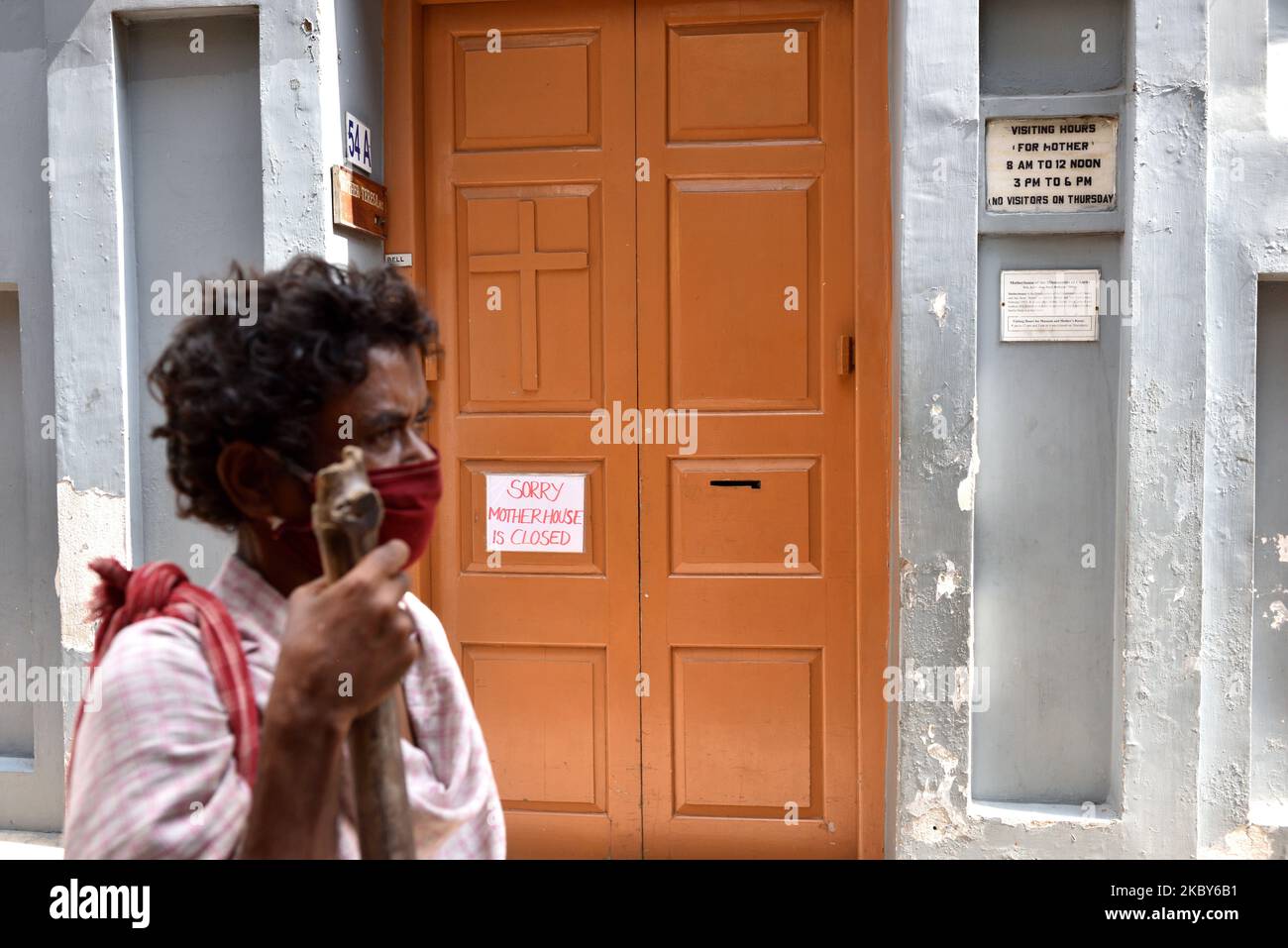A helpless man waits for food outside Mother's House for food on ...