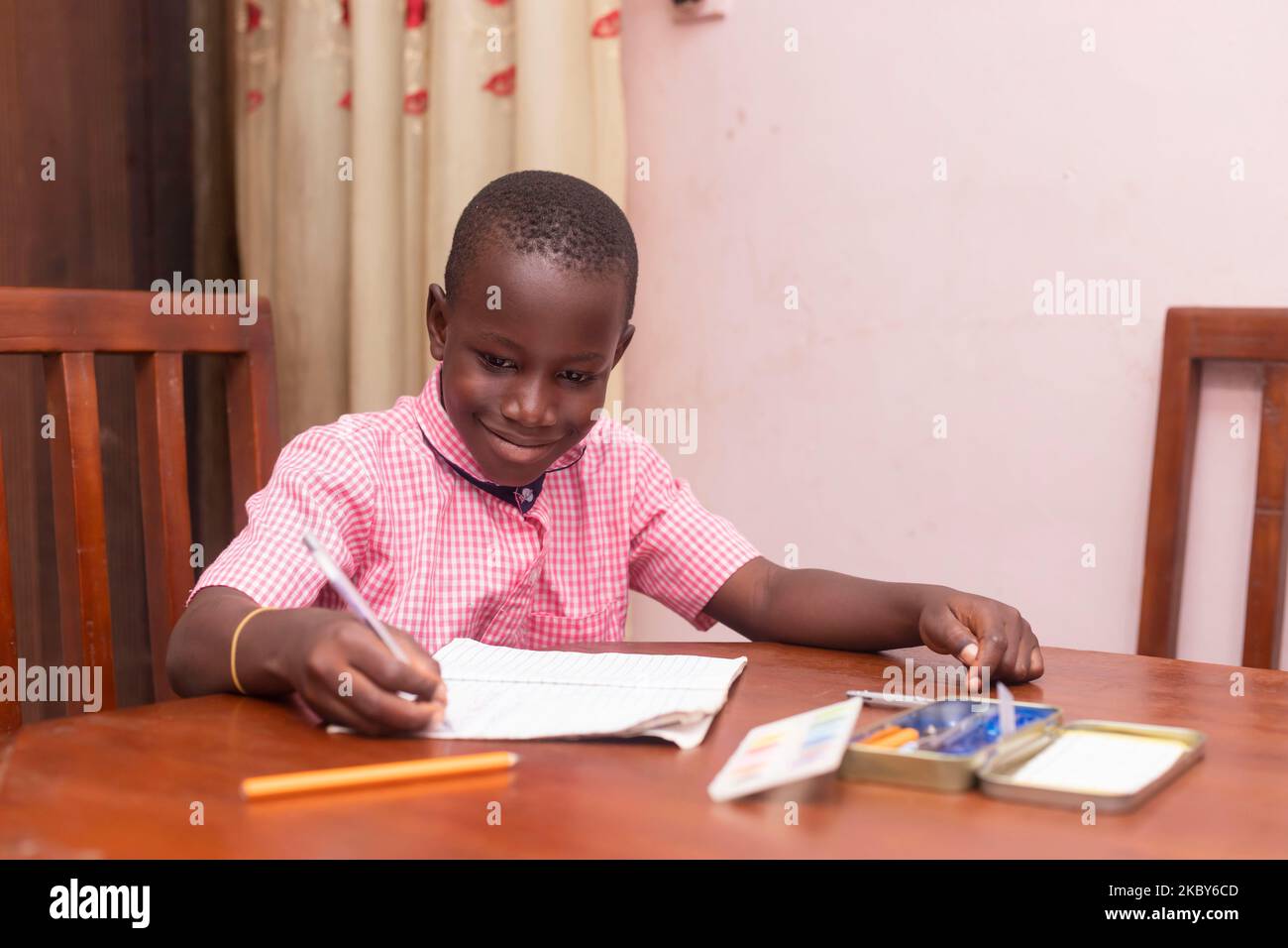 African boy thinking uniform hi-res stock photography and images - Alamy