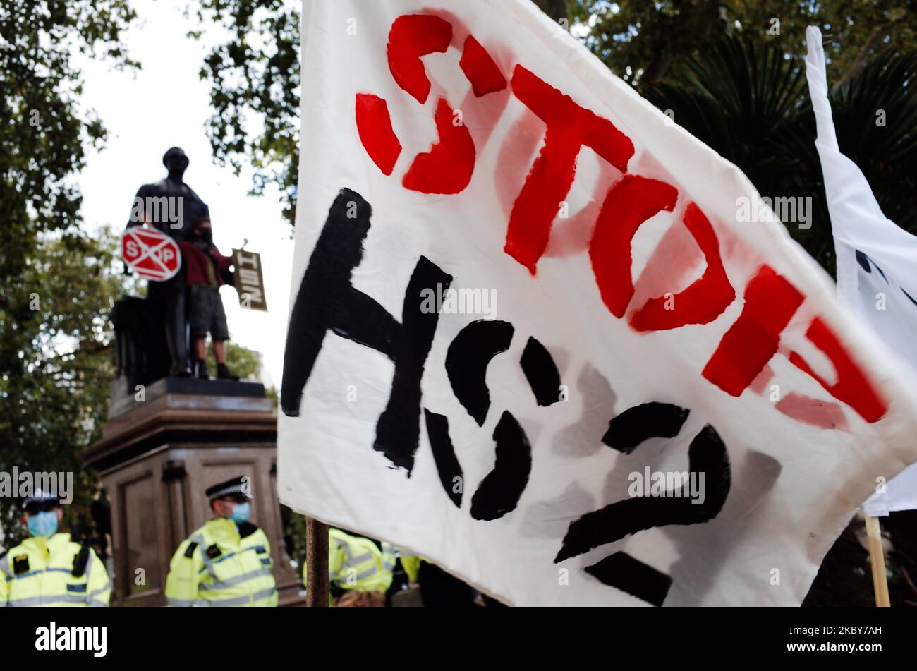 A 'Stop HS2' flag flies in front of a member of climate change activist ...