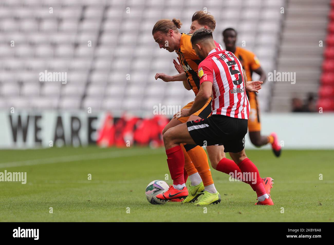 Tom Eaves of Hull City battles for possession with Sunderland's Bailey ...