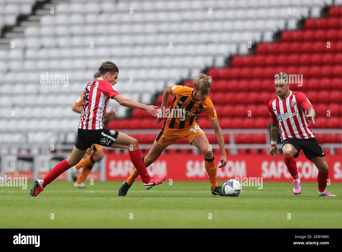 Martin Samuelsen of Hull City battles for possession with George Dobson ...