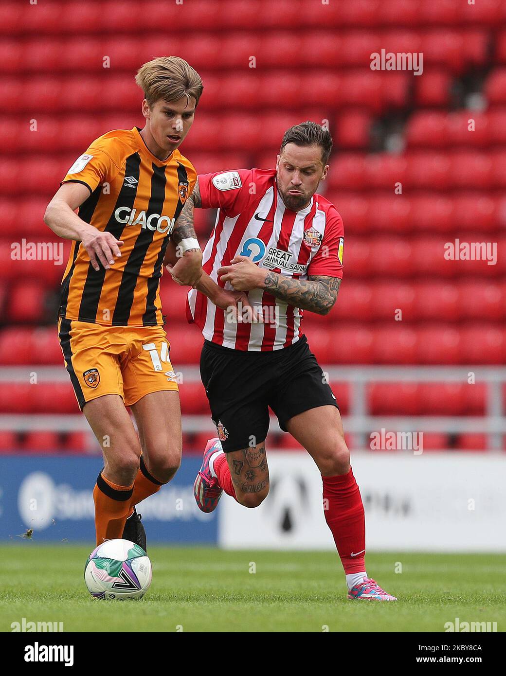 Martin Samuelsen of Hull City in action with Chris Maguire of ...