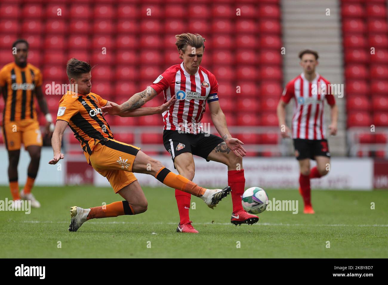 Reece Burke of Hull City tackels Sunderland's Max Power during the ...
