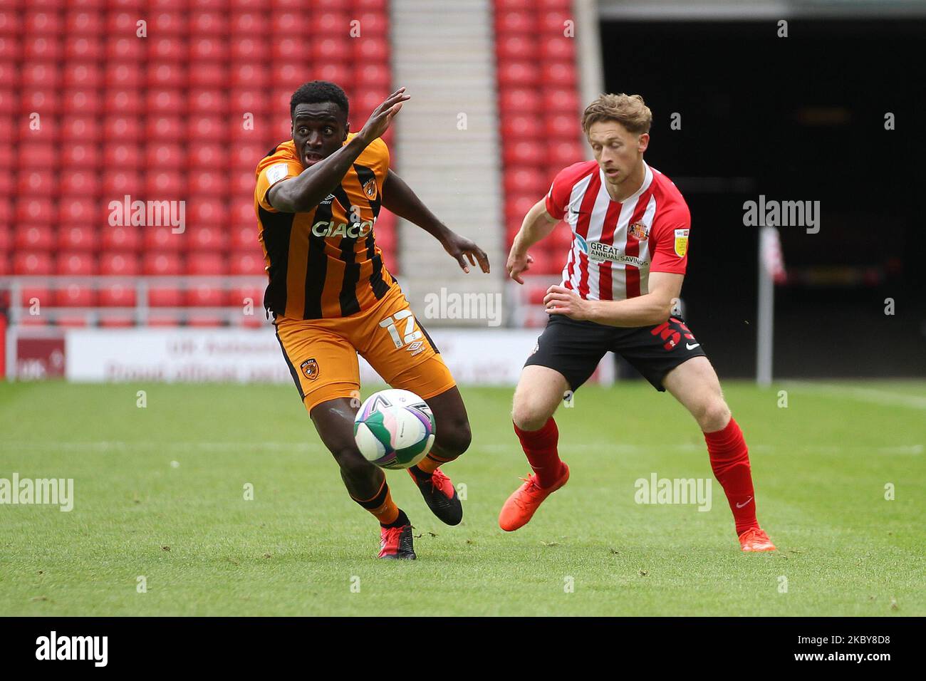 Josh Emmanuel of Hull City in action with Denver Hume of Sunderland ...