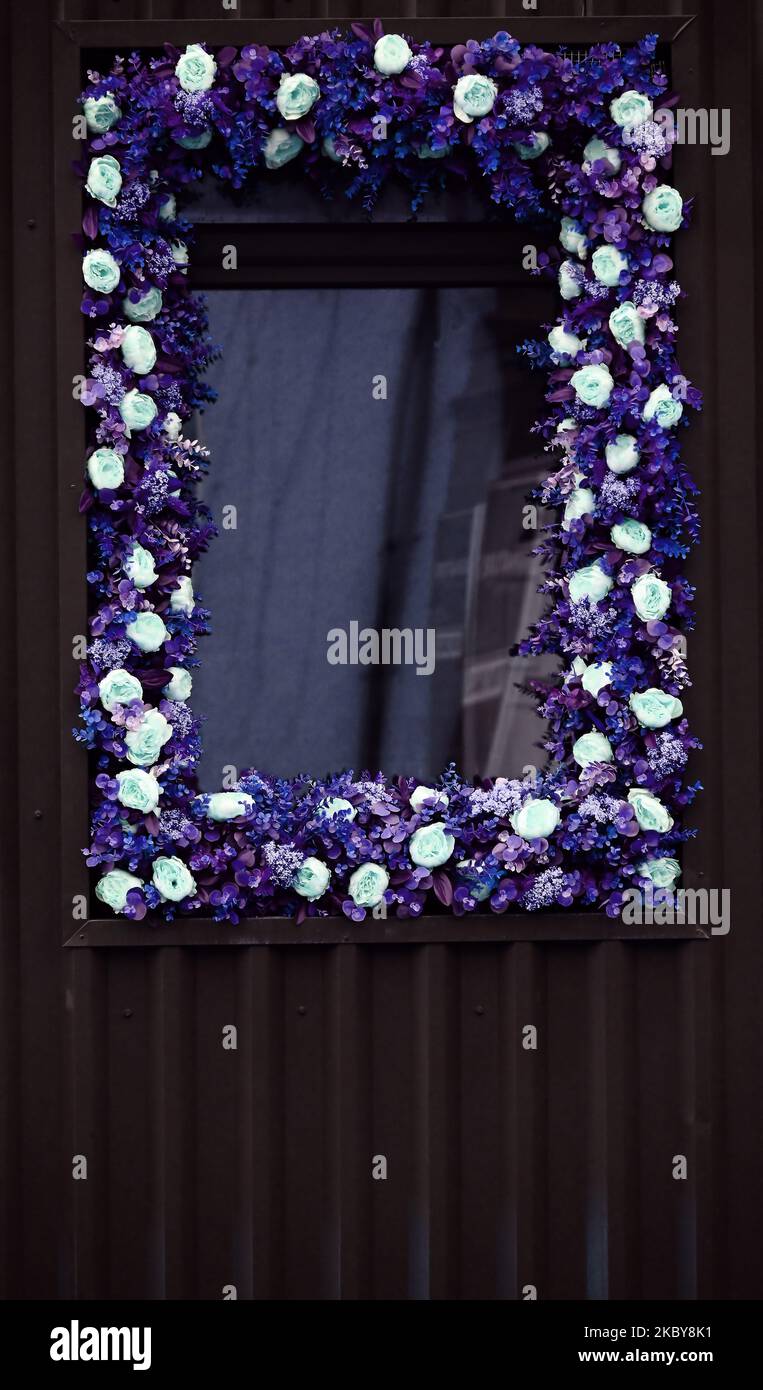 Blue and White flowers around steel corrugated door frame Stock Photo ...
