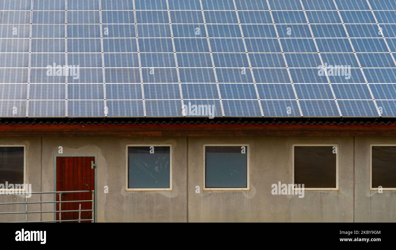 The solar system panels on the roof of a building Stock Photo - Alamy