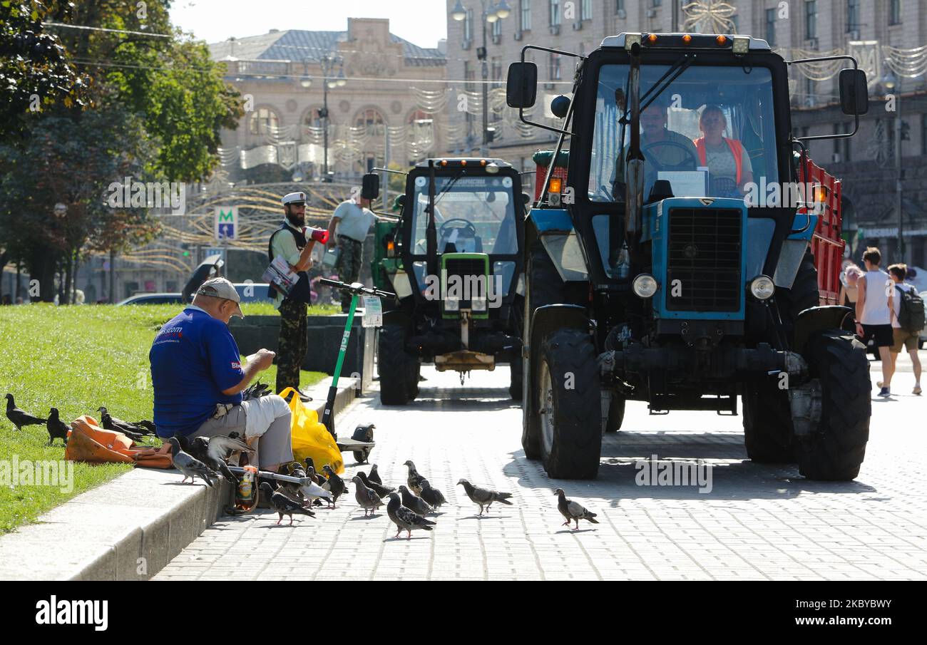 Tractors of communal services drive hi-res stock photography and images ...