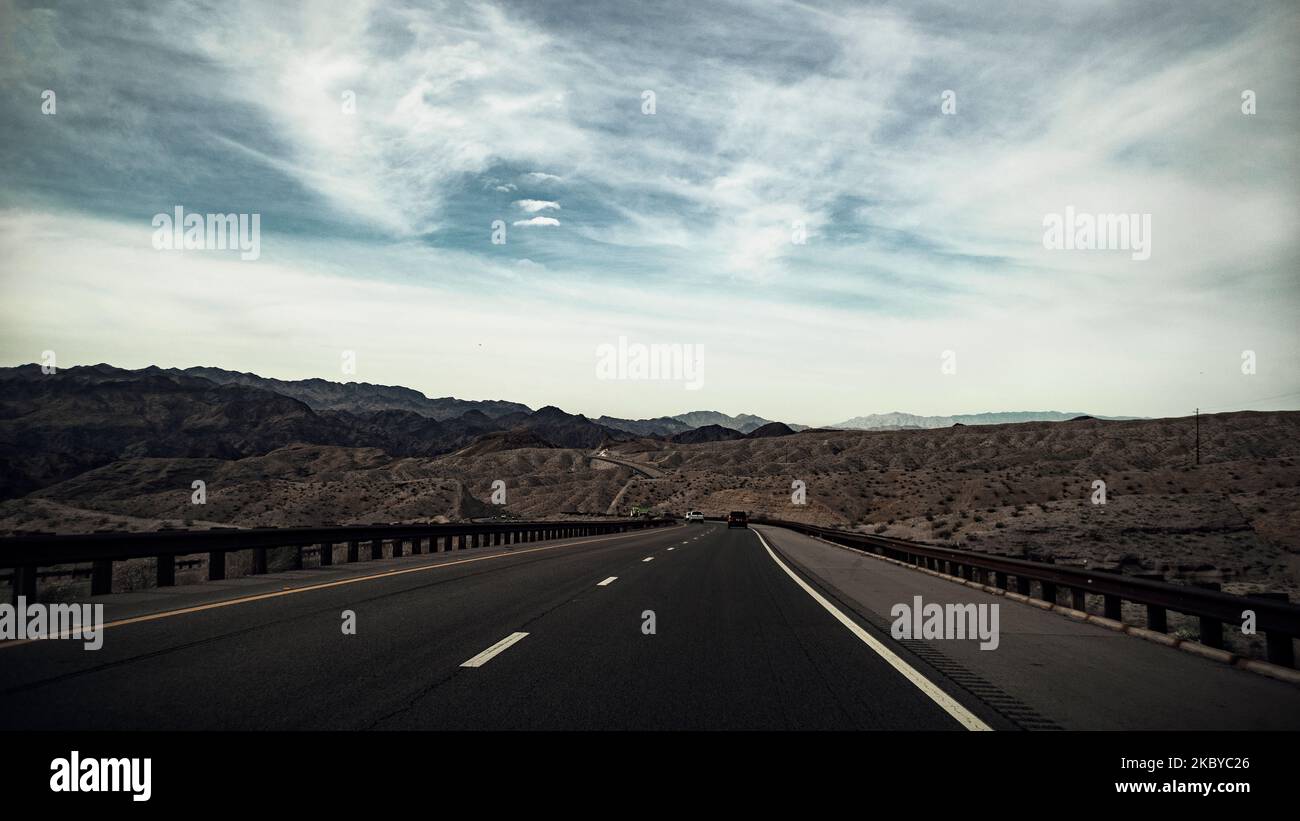A beautiful shot of an empty road in the middle of Nevada landscapes Stock Photo - Alamy