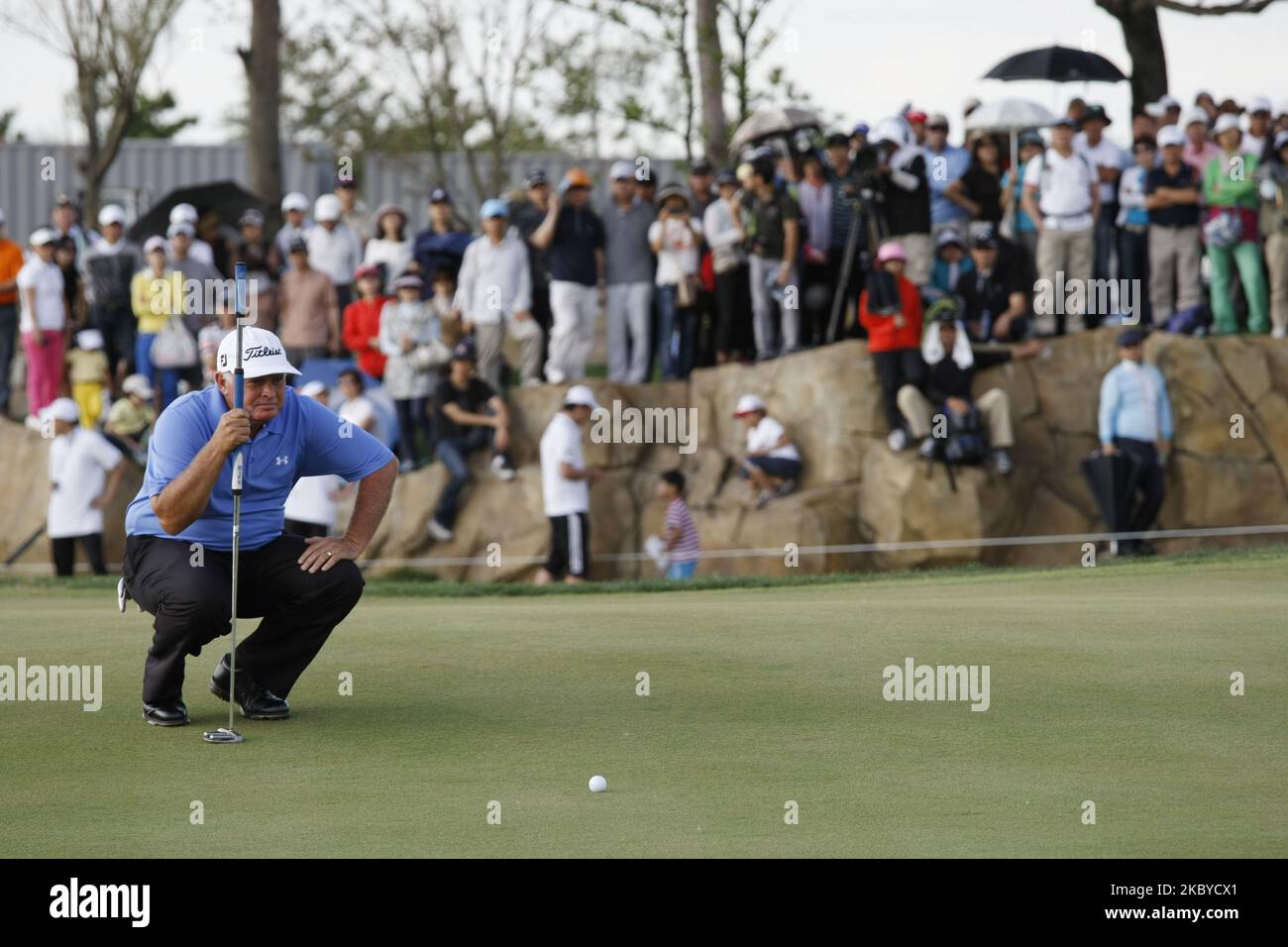Peter Senior of Australia, check his putting line of 18th hall during ...