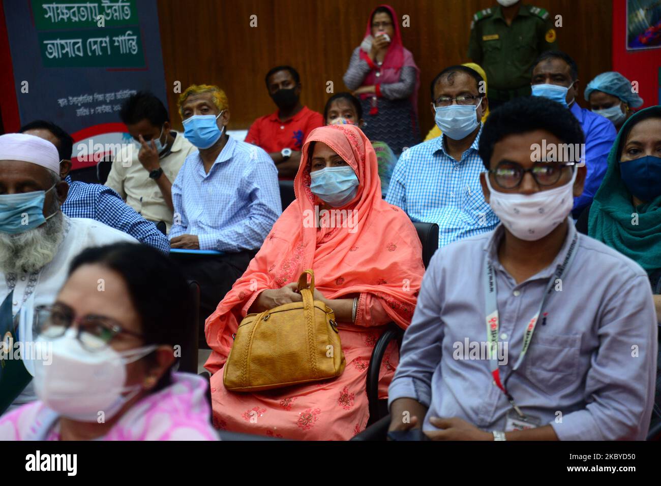 People wearing facemask attends at a seminar to celebrate World ...