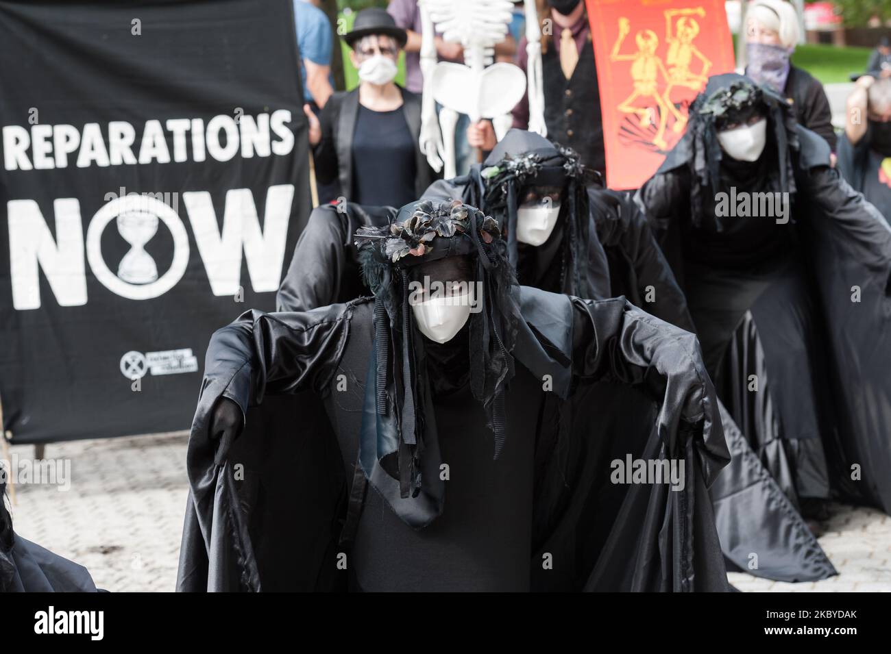 Extinction Rebellion's Black Brigade join a protest outside corporate ...