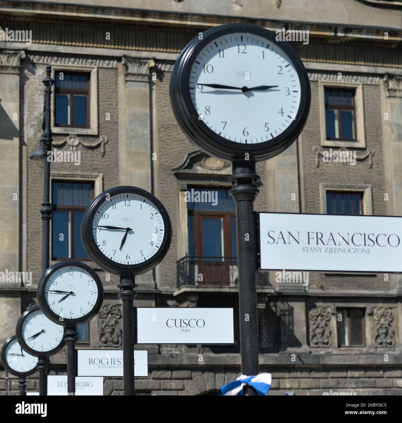 View of clocks showing the current time in Krakow's twin cities. The ...