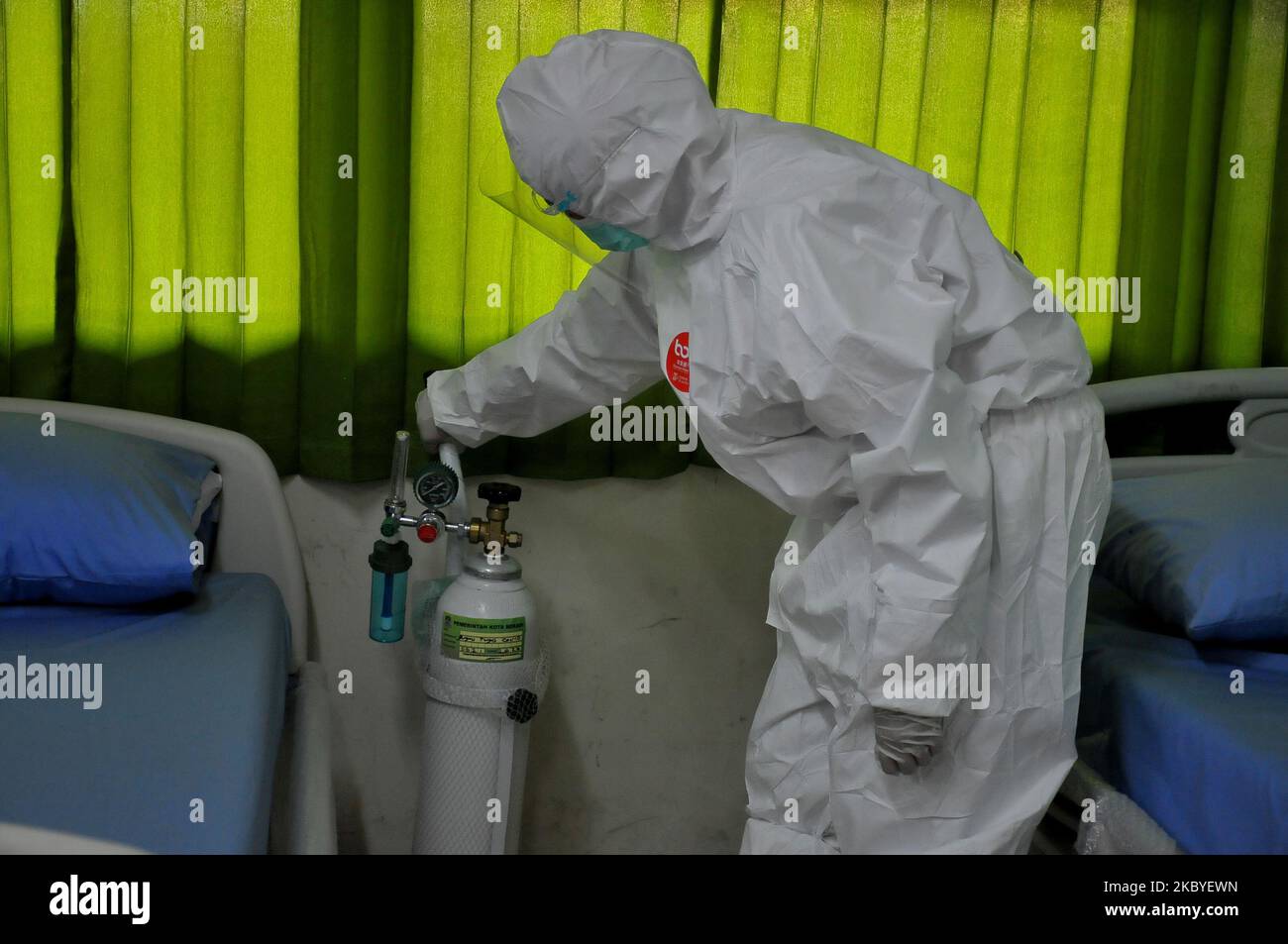 Medical officers inspect the emergency isolation room at the Patriot ...