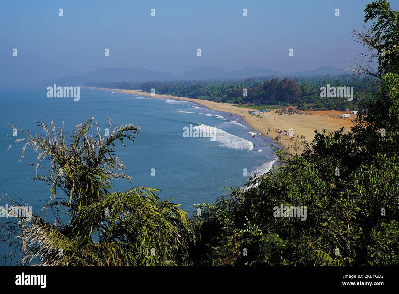 Beach in Goa or Karnataka - Indian people swimming in clothes swimming ...