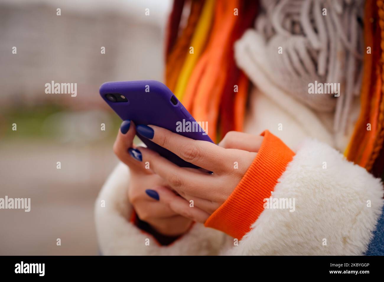 Anonymous female browsing mobile phone hi-res stock photography and ...