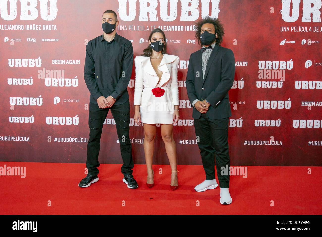 Marcelo Vieira (R), wife Clarice Alves (C) and Karim Benzema (L) attend ...