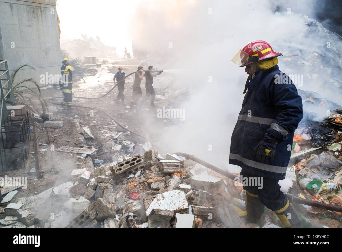 Lebanese firefighters try to put out a fire that broke out at Beirut's ...
