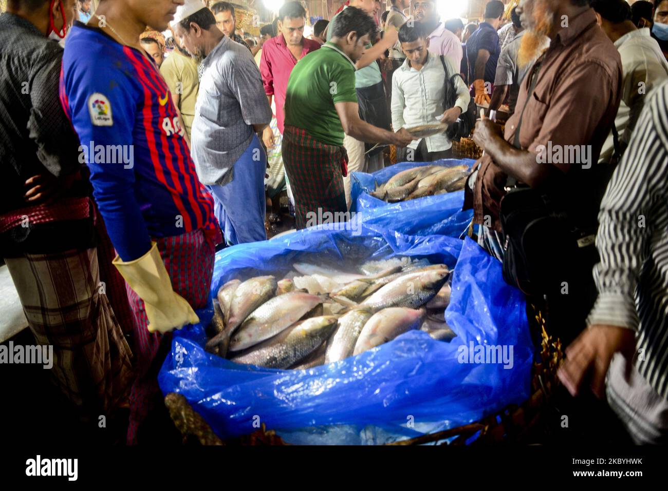 Bangladeshi vendors sell Hilsa fish at the Karwan Bazar wholesale fish ...