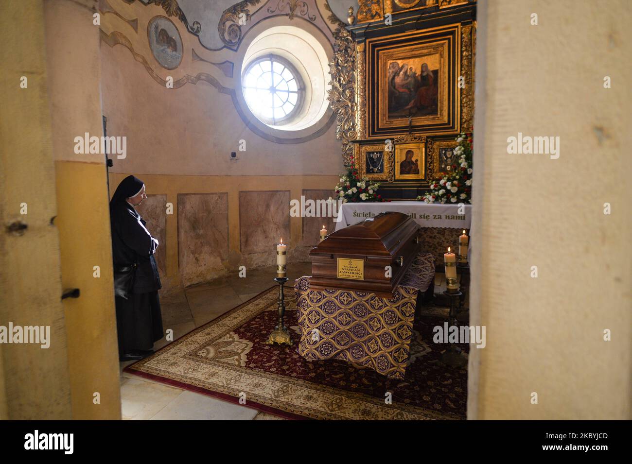A nun prays next to Cardinal Marian Jaworski's coffin ahead of the ...
