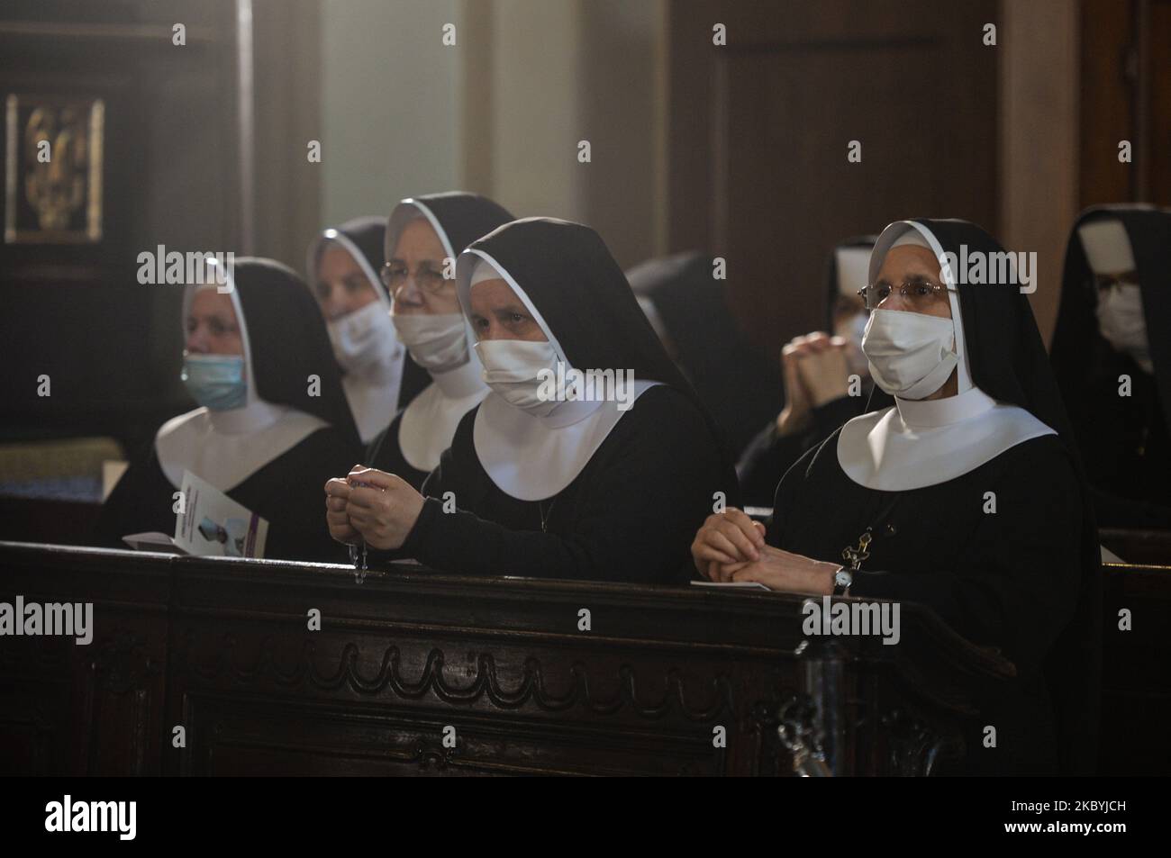 A group of nuns seen praying ahead of the funeral mass inside the ...