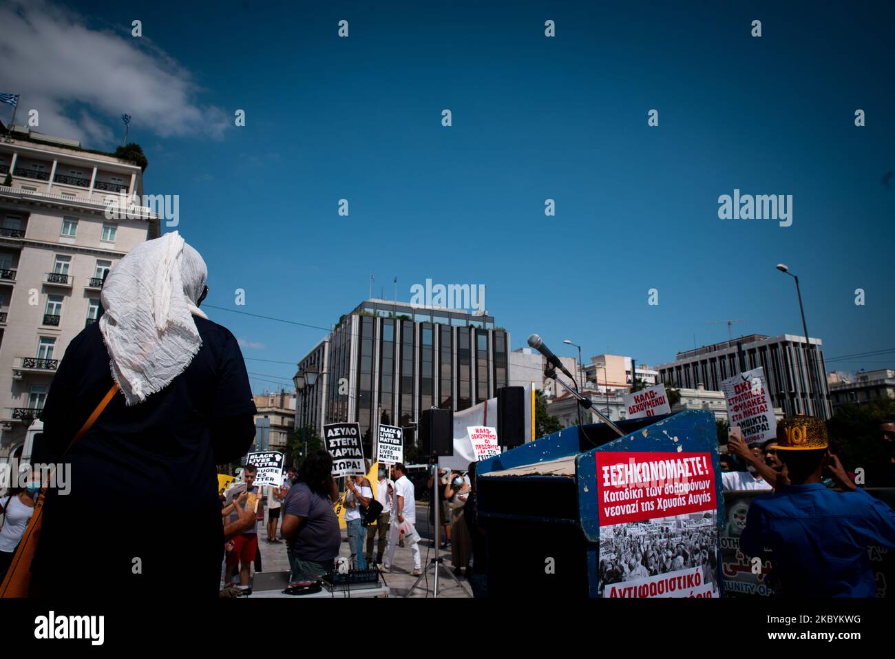 People shouting pro refugees slogans in front of the Greek parliament ...