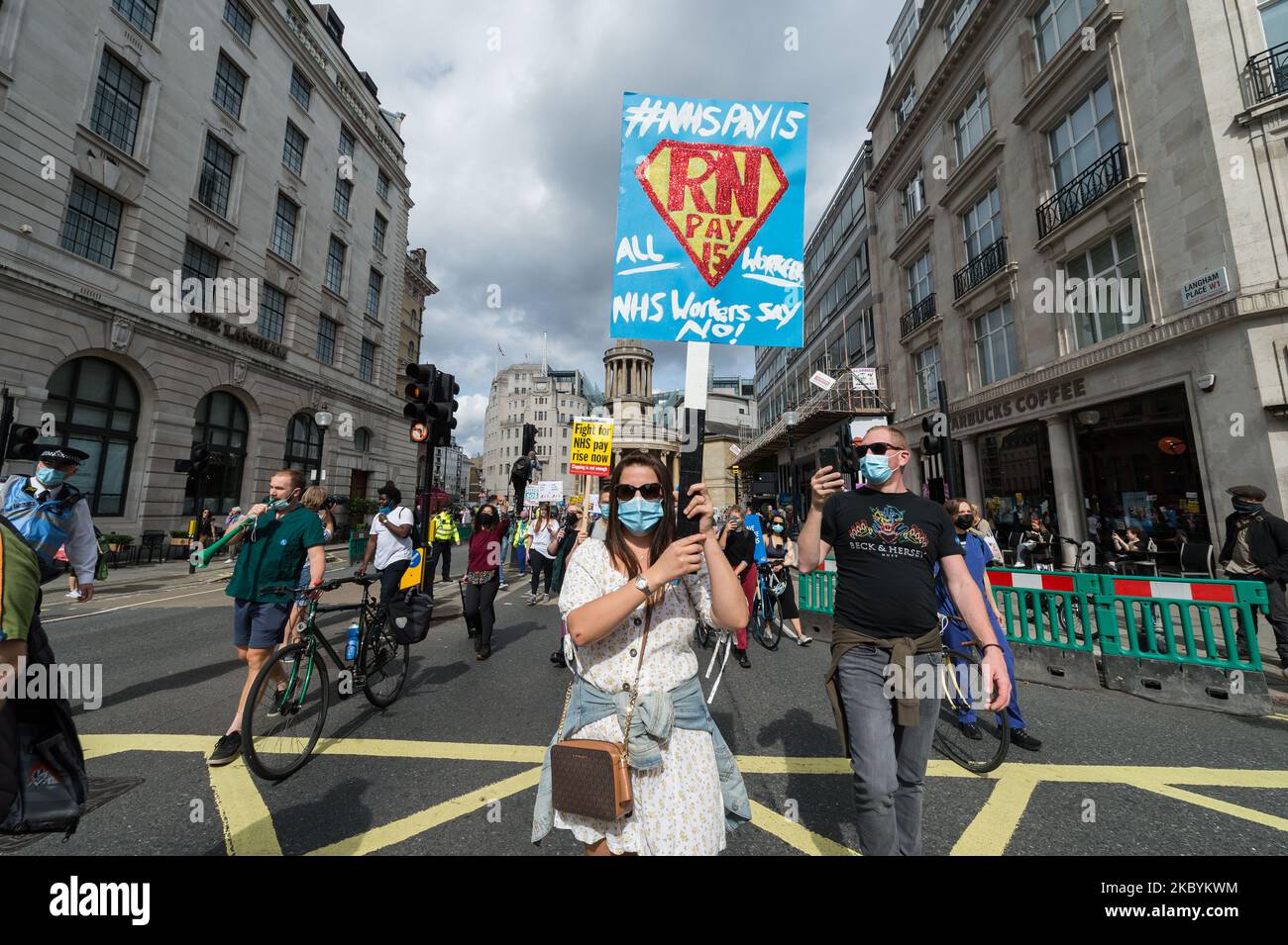 NHS staff march from BBC Broadcasting House to Trafalgar Square through ...