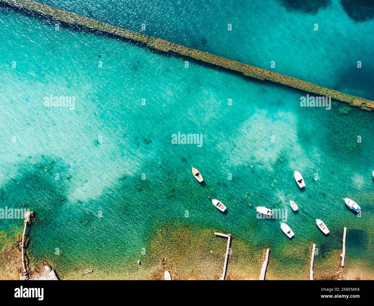 A calming aerial view of boats in the azure sea in Croatia Stock Photo ...