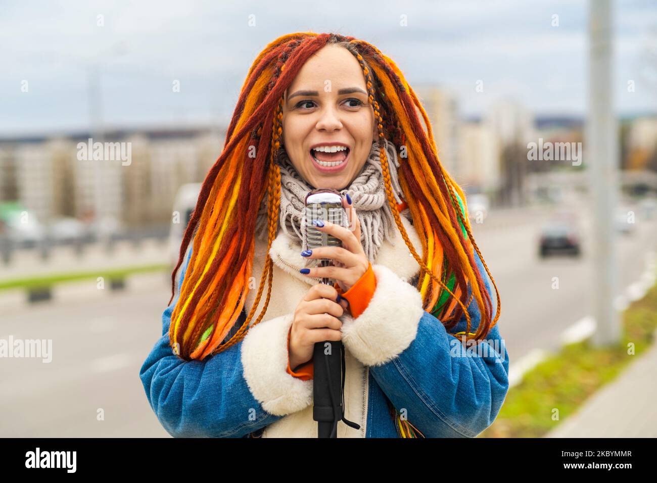 Female singer singing mic on hi-res stock photography and images - Alamy