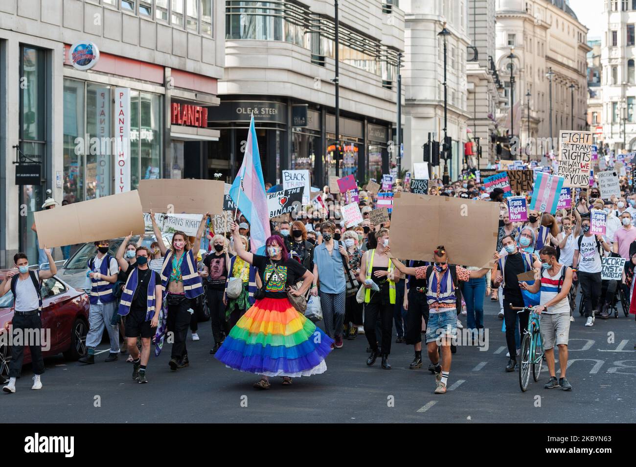Transgender people and their supporters march through central London ...