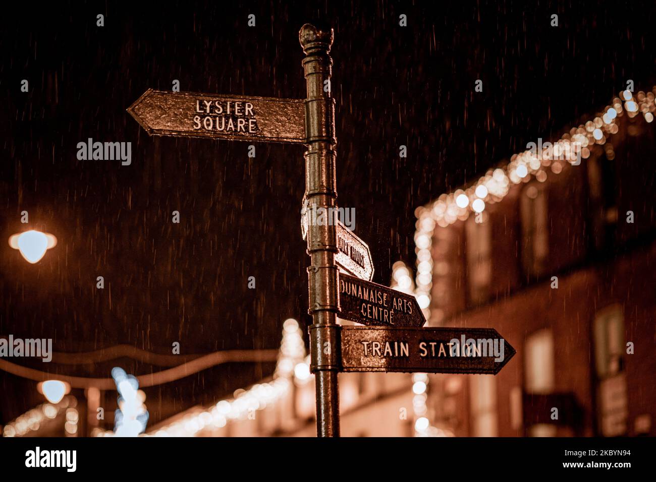 The direction signs in Ireland at night Stock Photo - Alamy