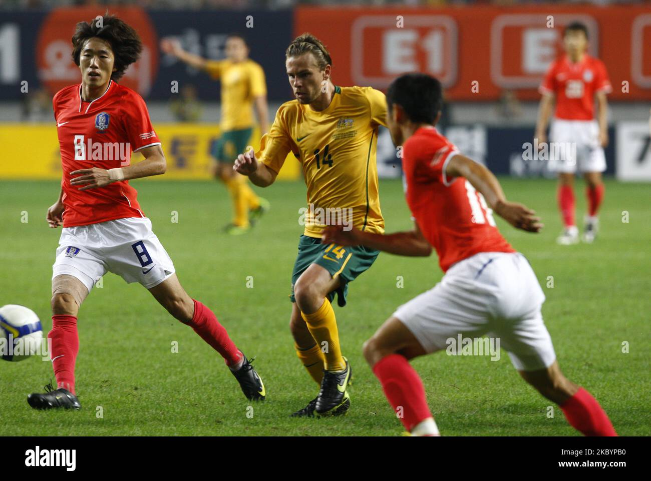 Brett Holman of Australia and Kim Jung-Woo of South Korea compete for ...