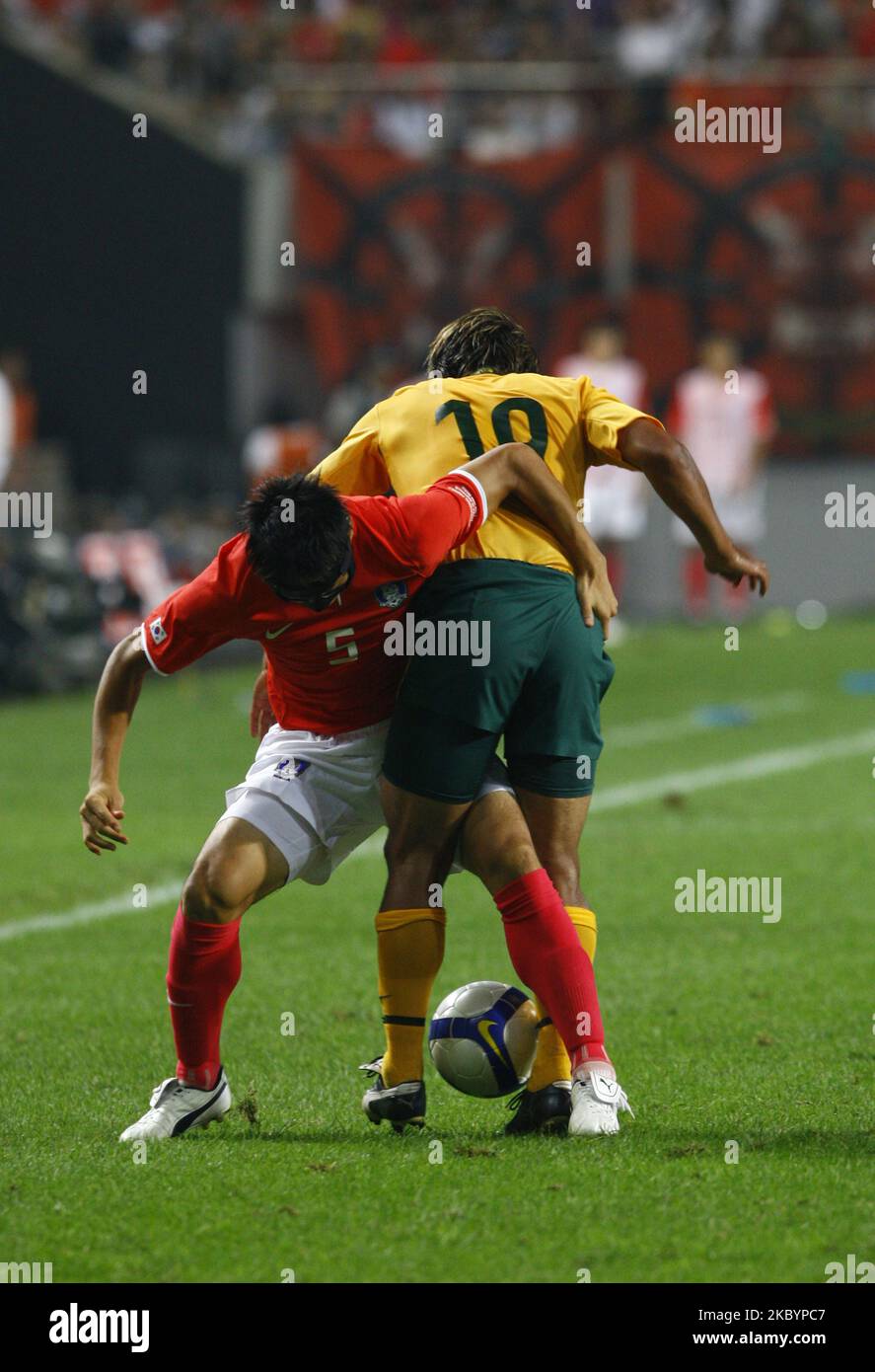 Nick Carle of Australia and Kim Nam-Il of South Korea compete for the ...