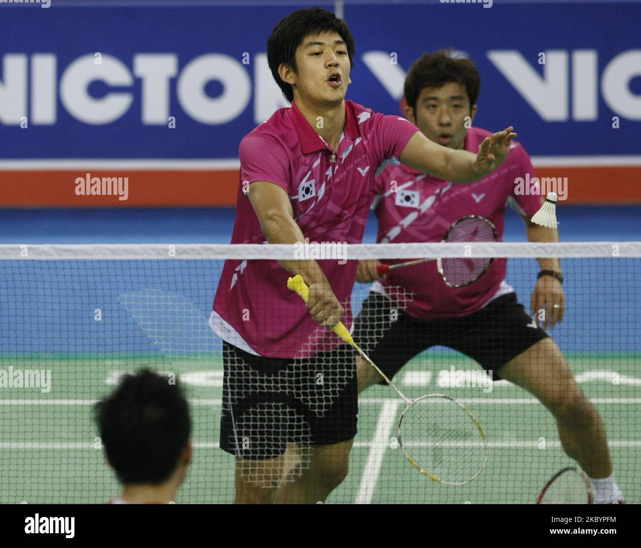 South Korea's Lee Yong Dae(front) and Jung Jae Sung(rear) compete with ...