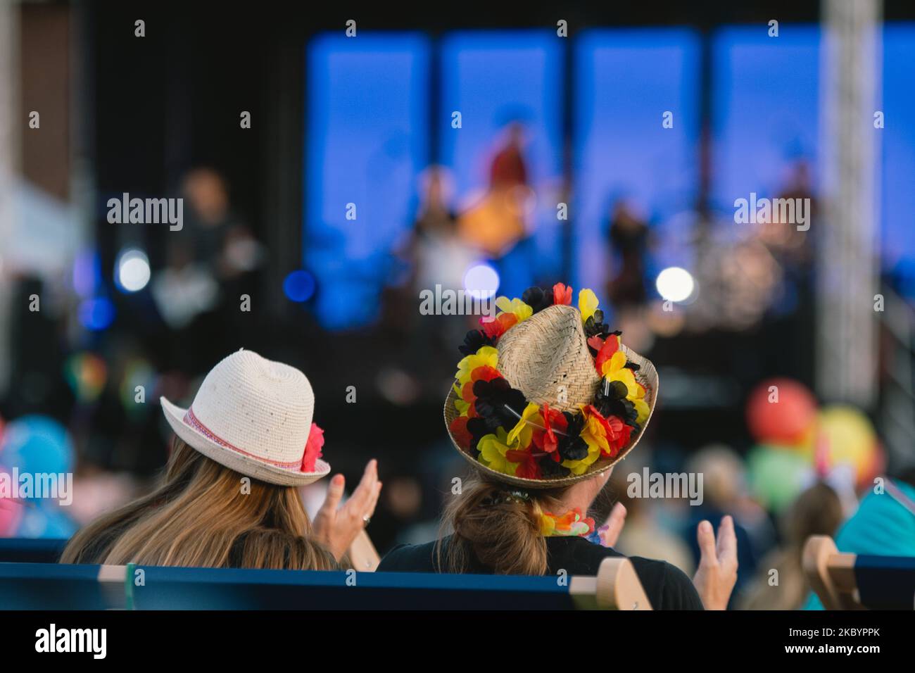concert goers claps hands during the outdoor concert of Come Together ...