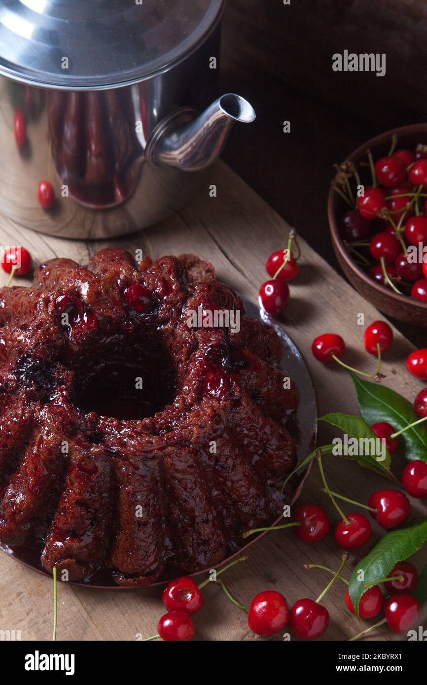 Composition on dark wooden background - delicious chocolate cake with ...