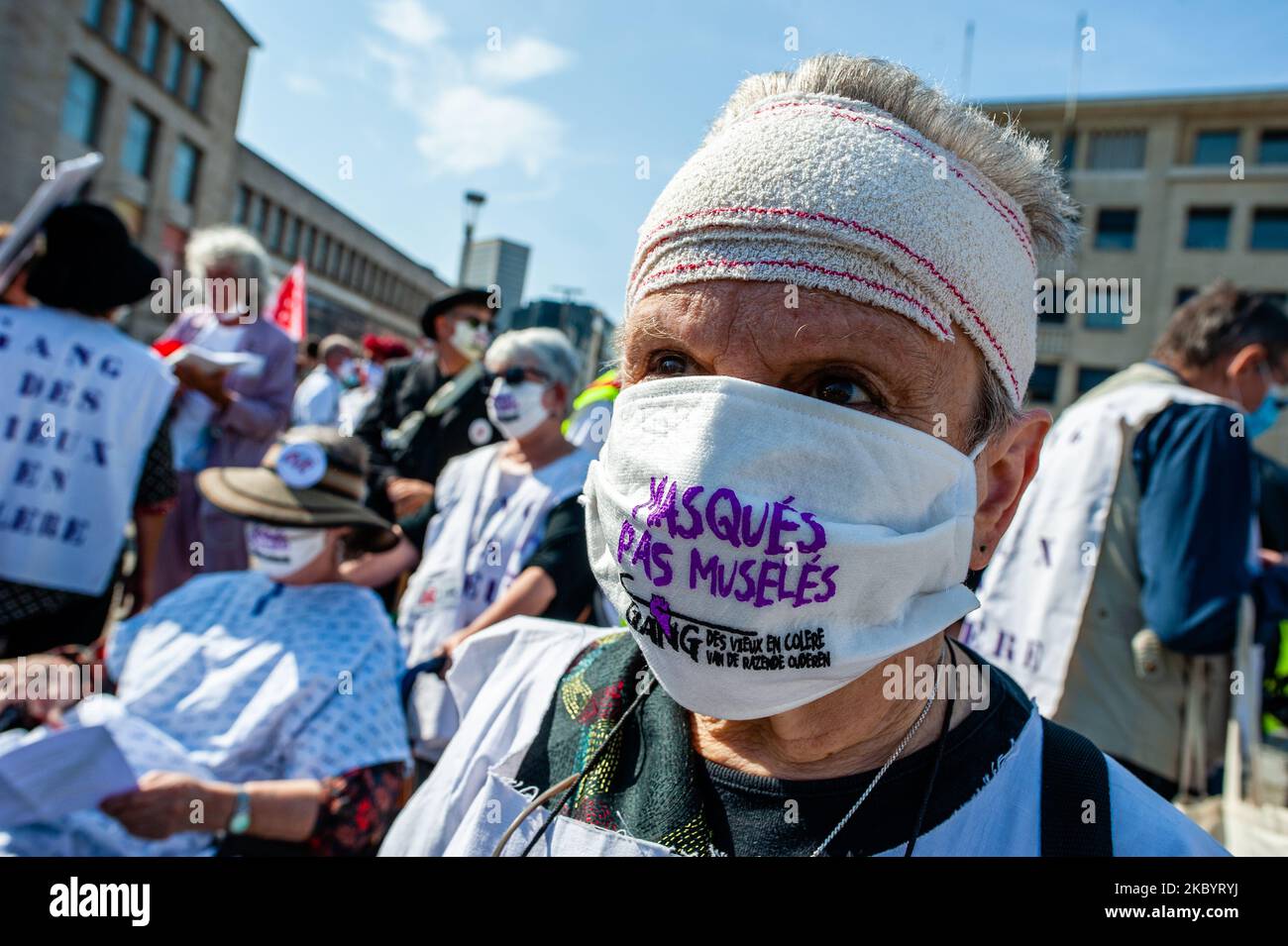 An old woman is using faking bandages during the Belgian health care ...