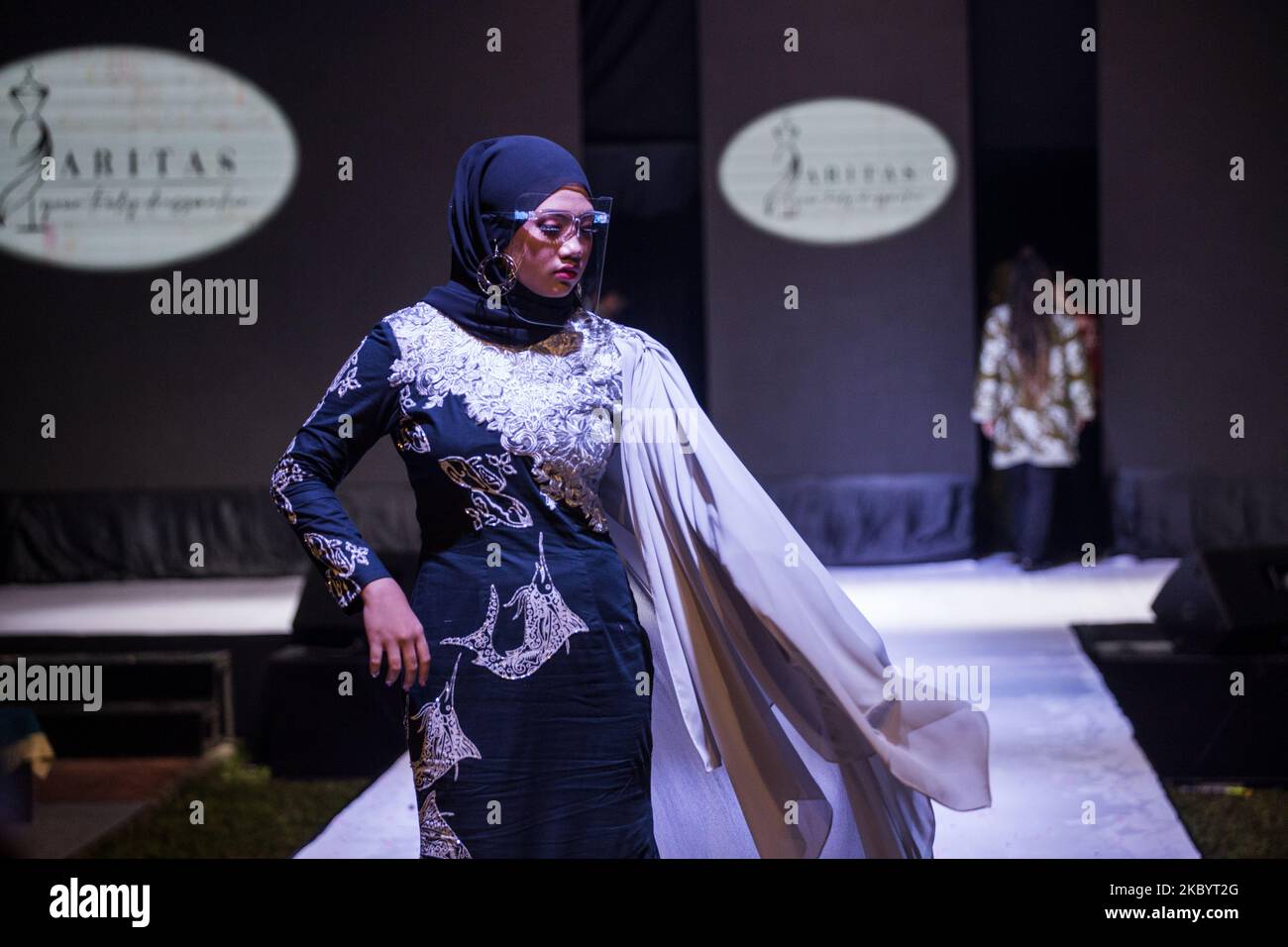 The model wore a marlin fish batik motif designed by a local designer ...