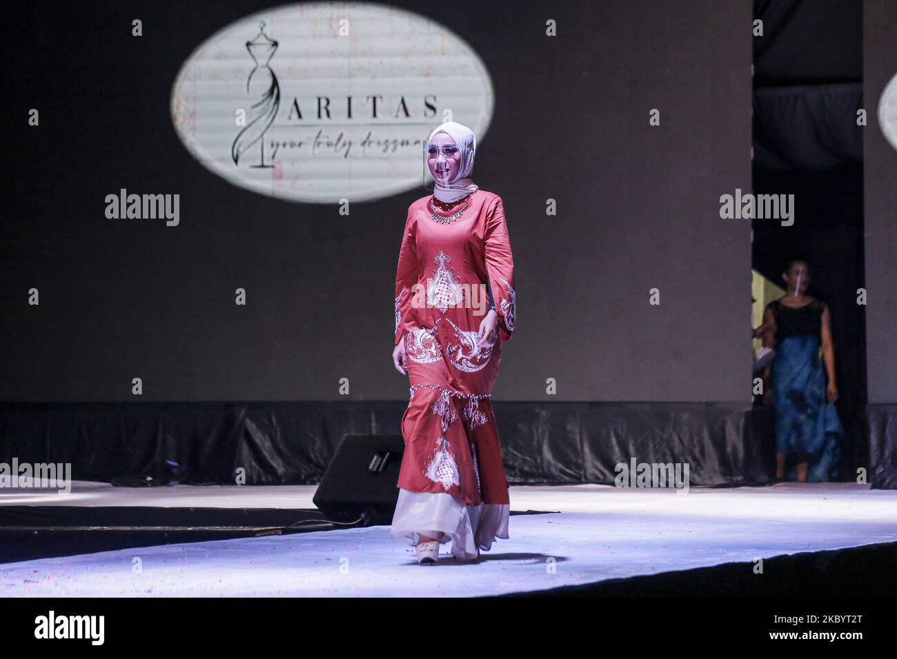 The model wore a marlin fish batik motif designed by a local designer ...