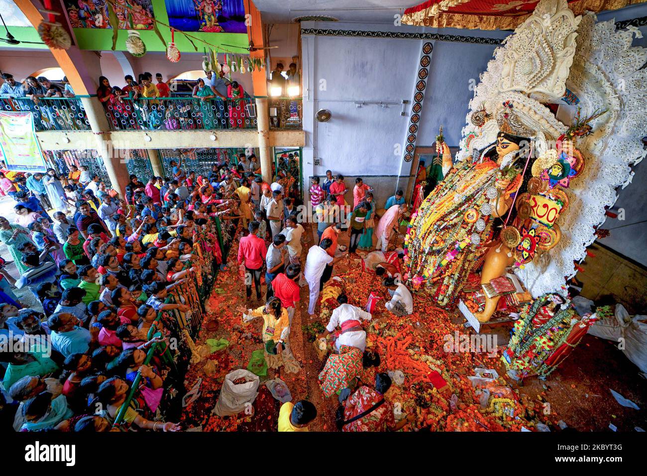 Indian Hindu devotees offering prayers during a procession prior to the ...