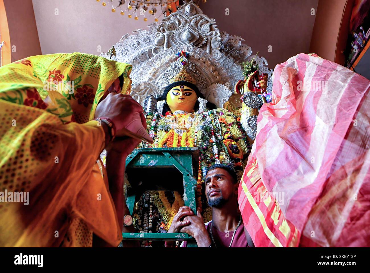 Hindu men seen dressed as a women (saree) perform the final worship ...