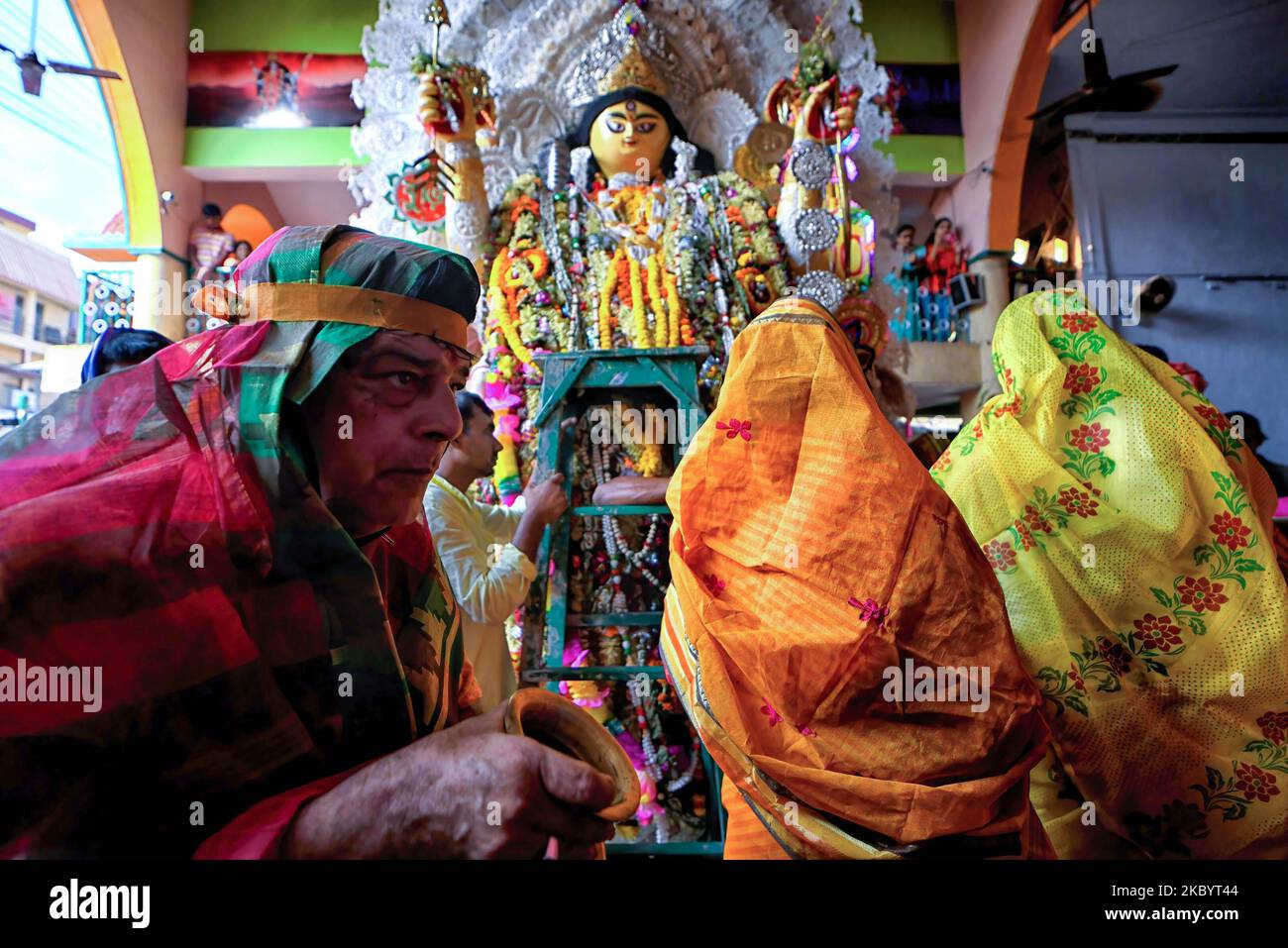 Hindu men seen dressed as a women (saree) perform the final worship ...