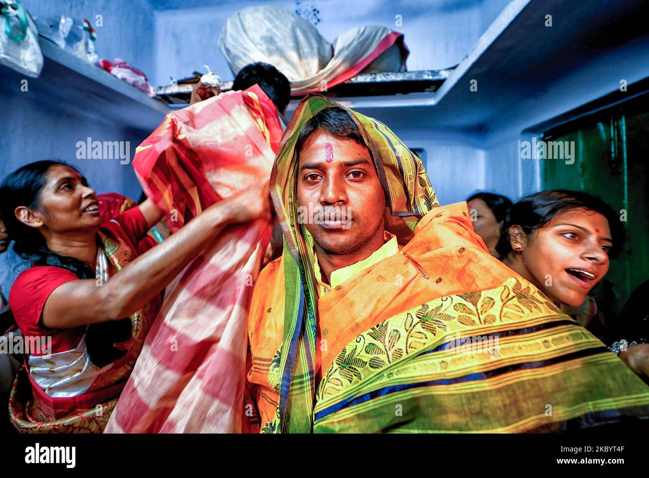 A Hindu man seen dressed up as a woman (saree) during jagadhatri puja ...