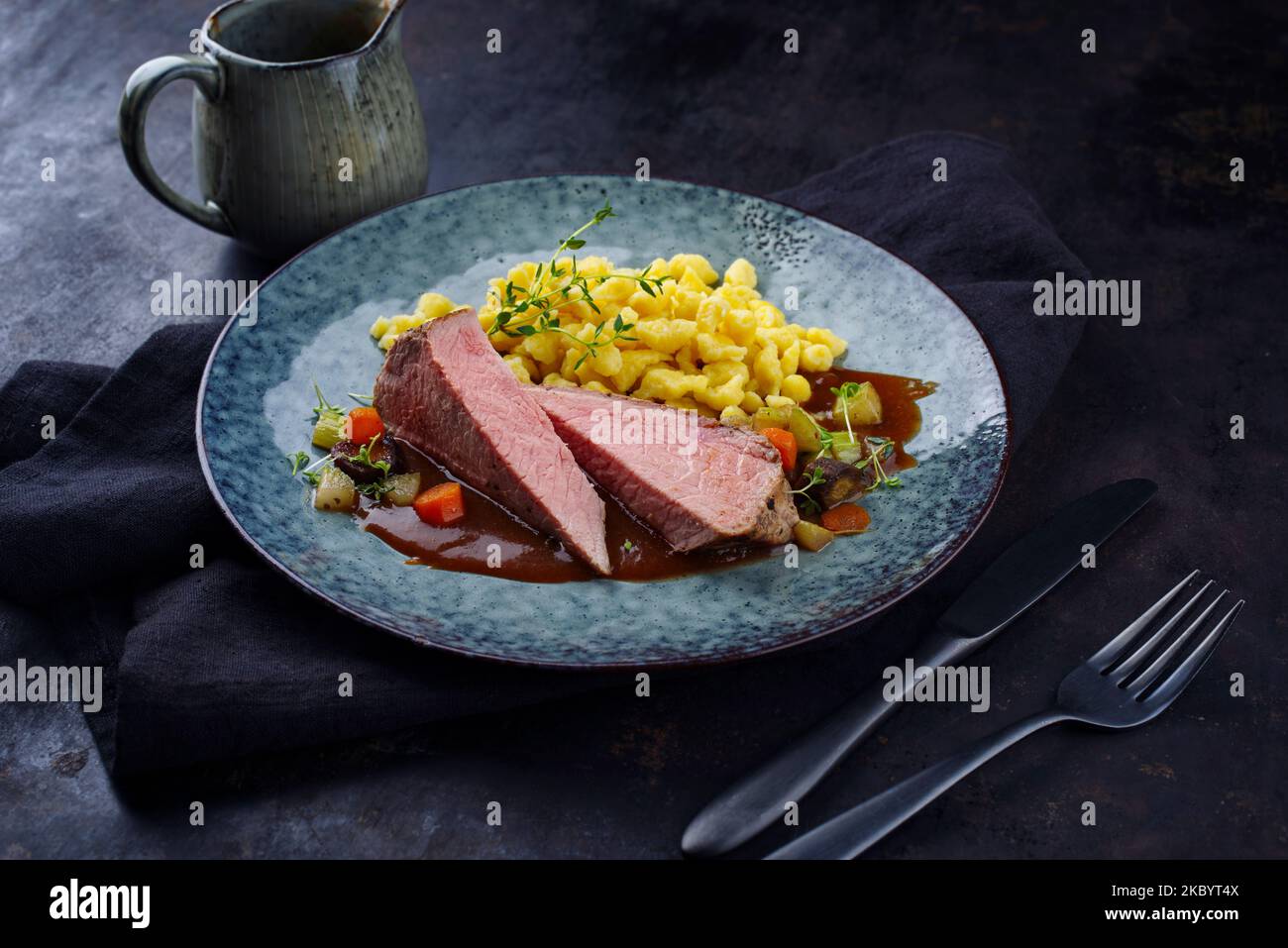 Tafelspitz roast veal slices with Swabian spaetzle and vegetable served ...